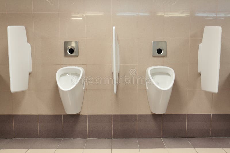 Male Urinals with Poster of Ladies Looking Editorial Stock Image ...