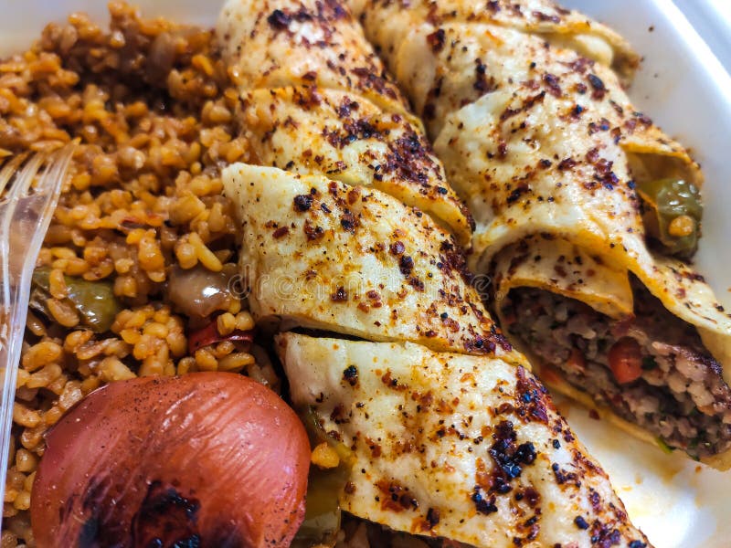 Turkish Beyti Kebab Served with Bulgur Pilaf and Yoghurt. Stock Photo ...