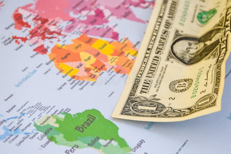 US Dollar Banknotes on Globe World Map, American Investment and Trading ...