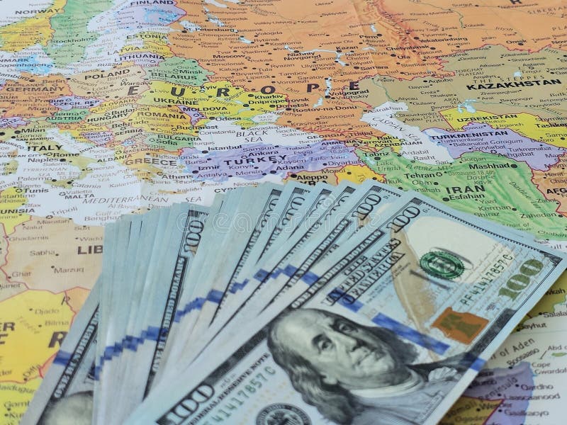 US Dollar Banknotes on World Globe Map Background. Counting Money ...