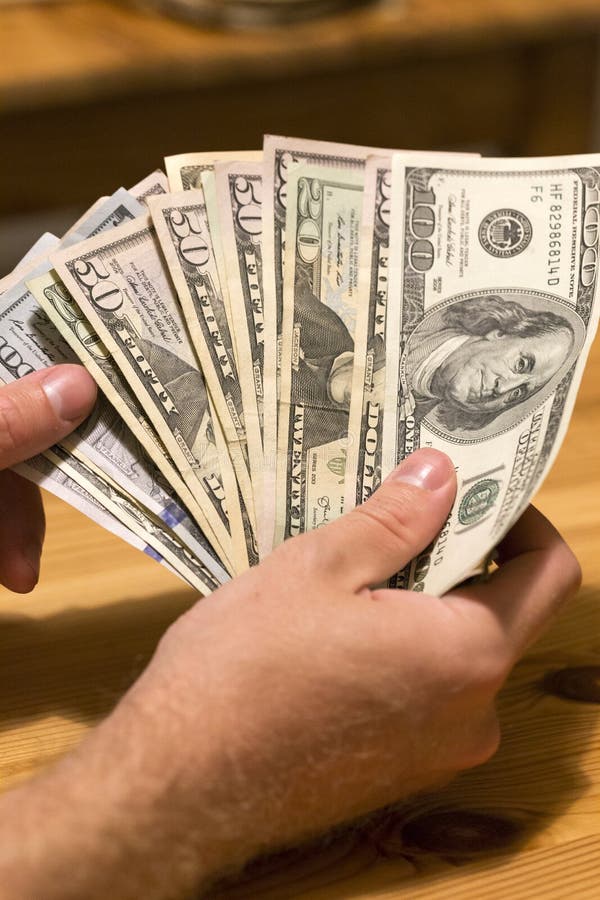US Dollar Bills in the Hand Stock Photo - Image of hand, business: 98595572