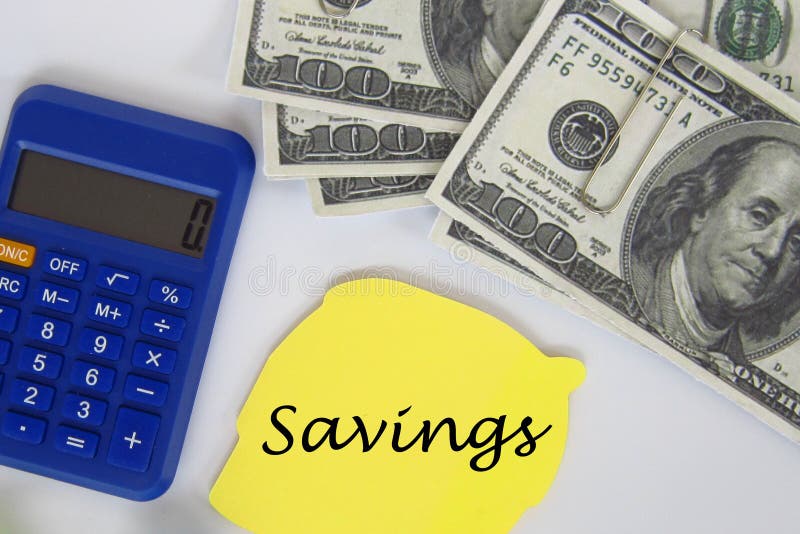 A US Dollar Money, a Calculator and Notes with Text SAVINGS Stock Photo ...