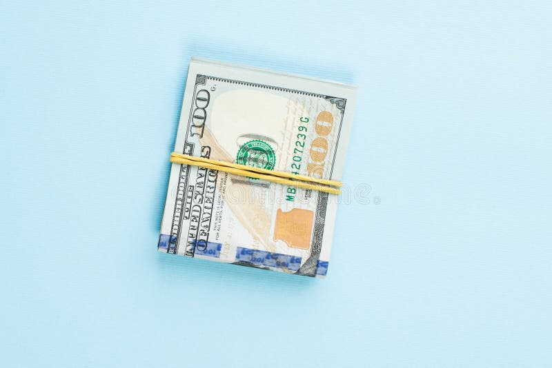 100 US Dollar Money Cash on Blue Table Background Stock Photo - Image ...