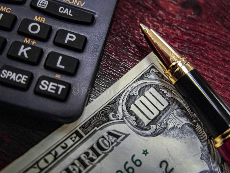 US Dollar Money Notes, Pen and Calculator on the Table Stock Image ...