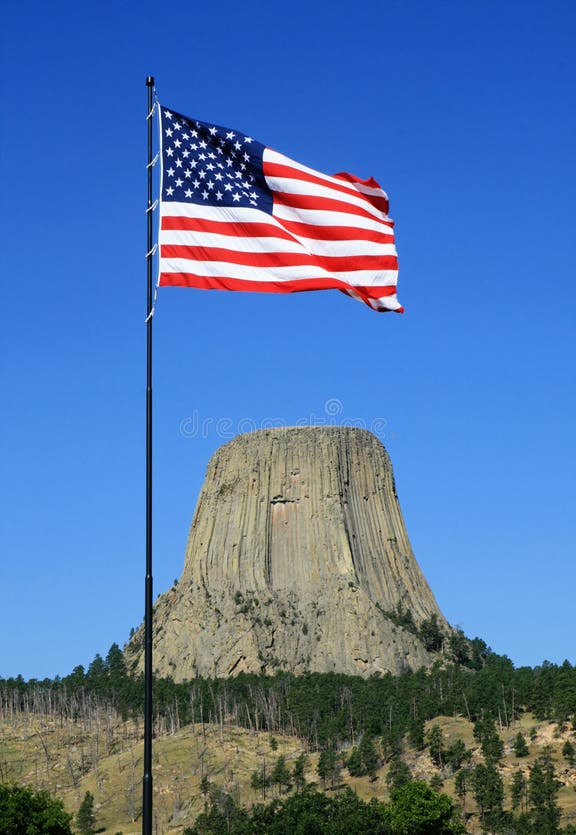 US flag at devils tower stock photo. Image of landmark - 16019568