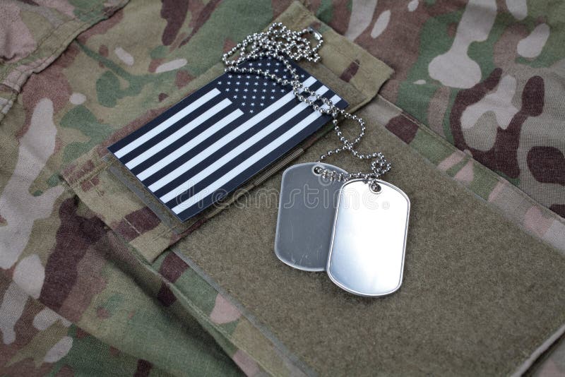 US Flag Patch with Dog Tag on US ARMY Camouflage Uniform Stock Photo ...