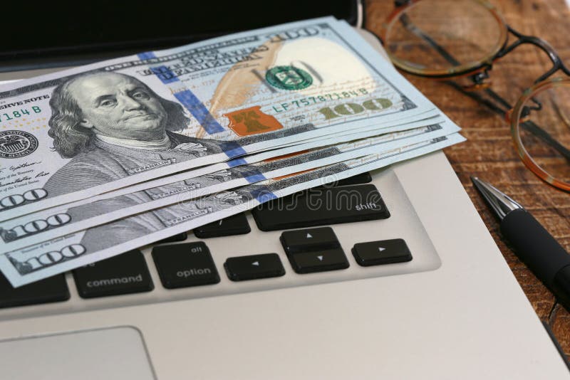 Money on computer keyboard stock photo. Image of internet - 237990114