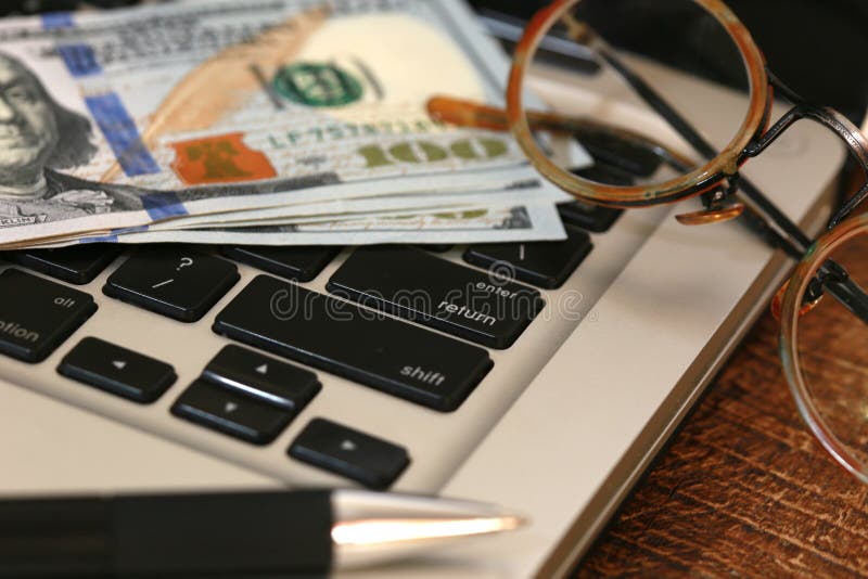 Money on computer keyboard stock photo. Image of dollars - 237990170