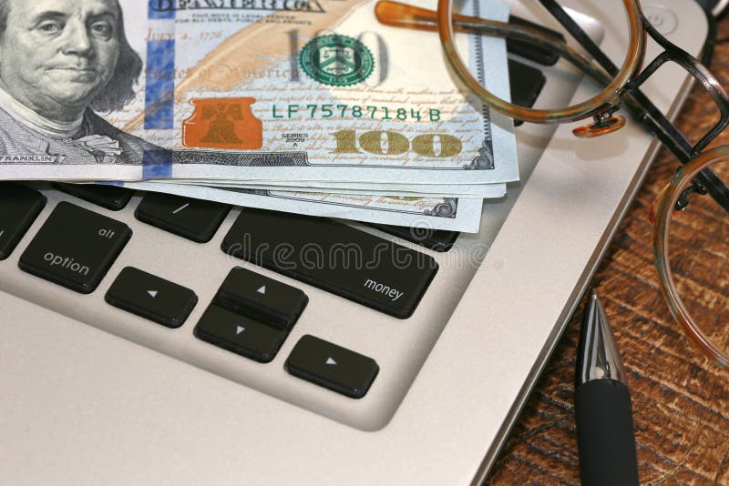 Money on computer keyboard stock photo. Image of sale - 237990172