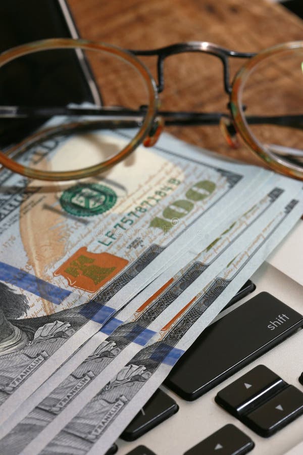Money on computer keyboard stock photo. Image of internet - 237990176