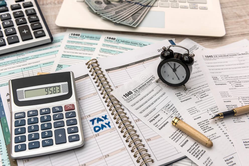 US 1040 Tax Form with Notepad, Calculator and Pen. Tax Concept ...