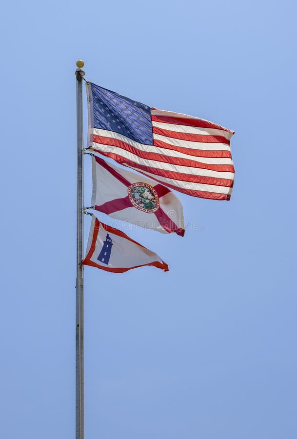 USA, Florida and Lighthouse Flags Over a Blue Sky Editorial Photography ...