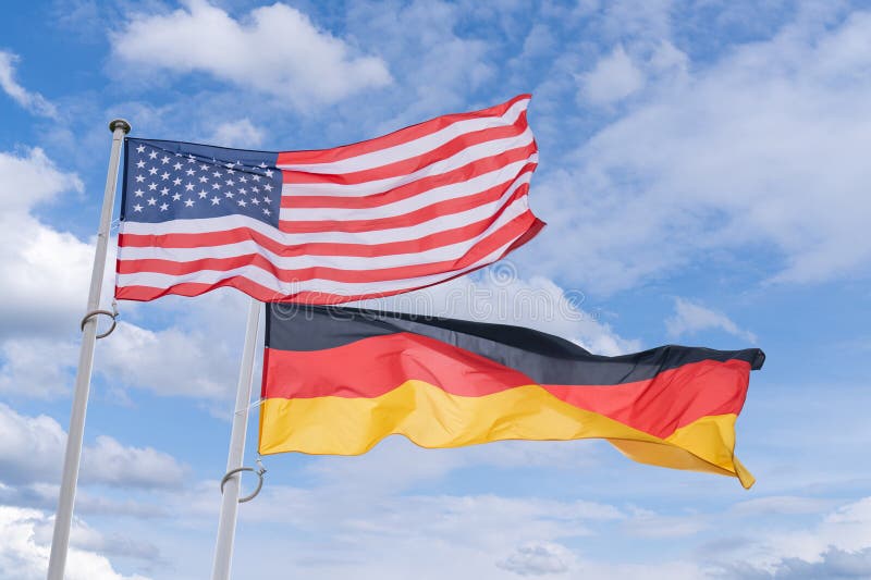 USA and German Flags Flutter in the Wind. Stock Image - Image of ...