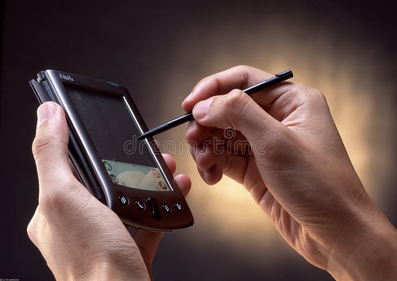 Usando PDA foto de archivo. Imagen de negocios, ejecutivo - 40522024