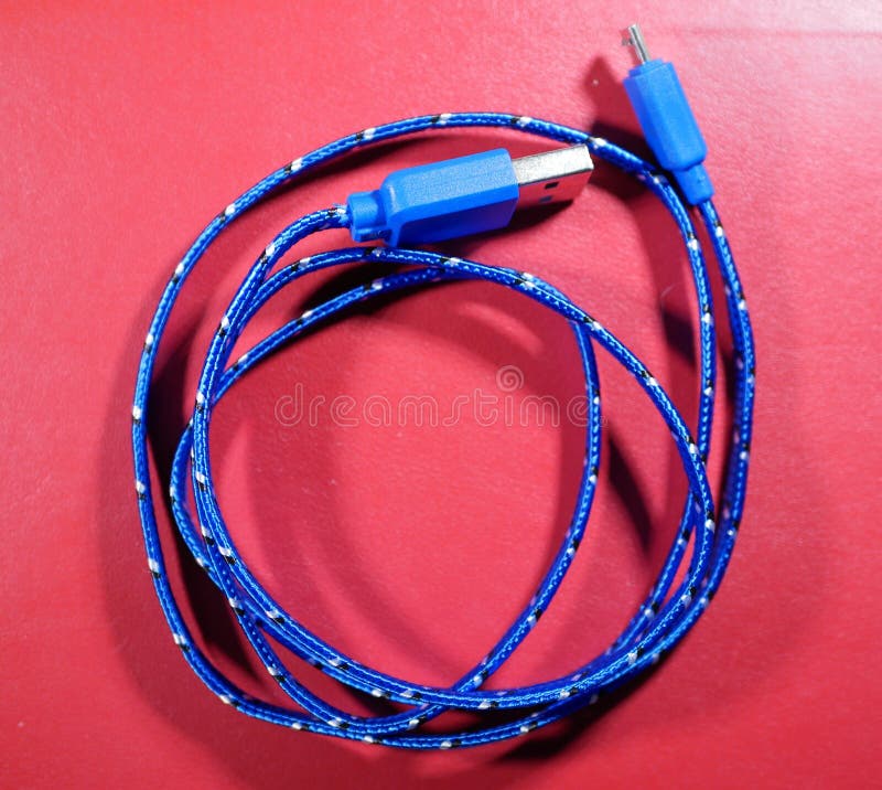 USB Cable in Blue Braid with White Dots on Red Background. Stock Photo ...