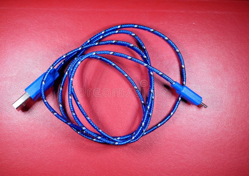 USB Cable in Blue Braid with White Dots on Red Background. Stock Image ...