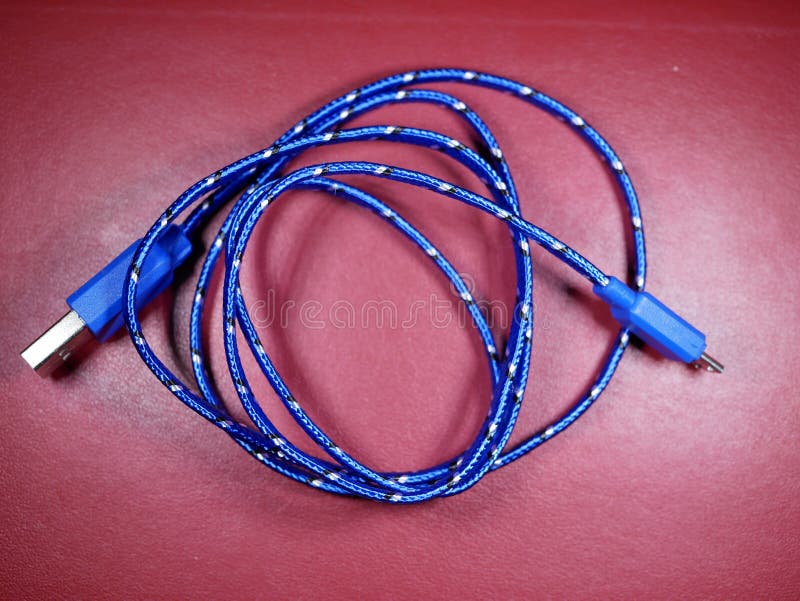 USB Cable in Blue Braid with White Dots on Red Background. Stock Image ...