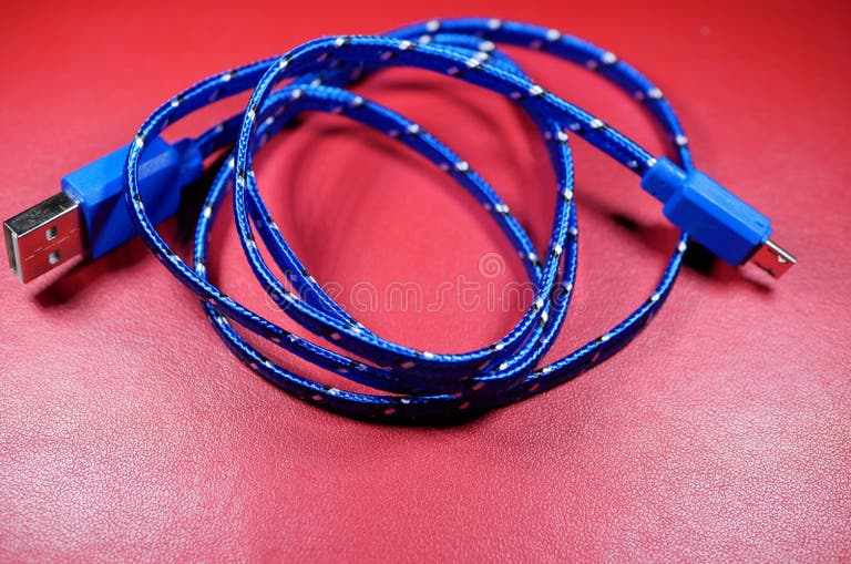 USB Cable in Blue Braid with White Dots on Red Background. Stock Image ...