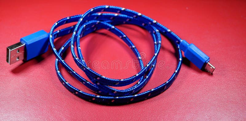 USB Cable in Blue Braid with White Dots on Red Background. Stock Image ...