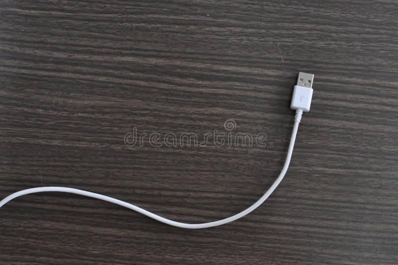 USB Cable Charging on Wood Table Stock Image - Image of cell, table ...