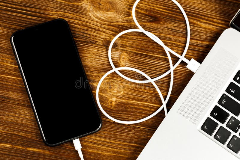 A USB Cable Connects Your Phone and Laptop Stock Photo - Image of ...