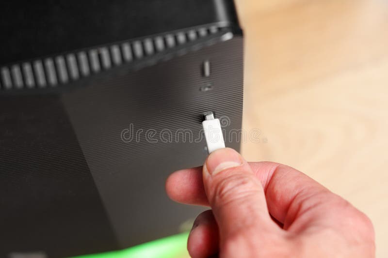 USB Cable Plug Connecting by the User Hand To an Computer Close Up ...