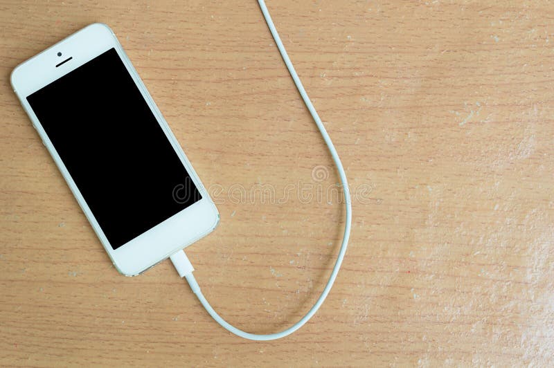 USB Cable with Smartphone on Wood Table Stock Image - Image of screen ...
