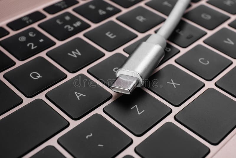 USB Cable with Type C Connector on Laptop Keyboard, Closeup Stock Photo ...
