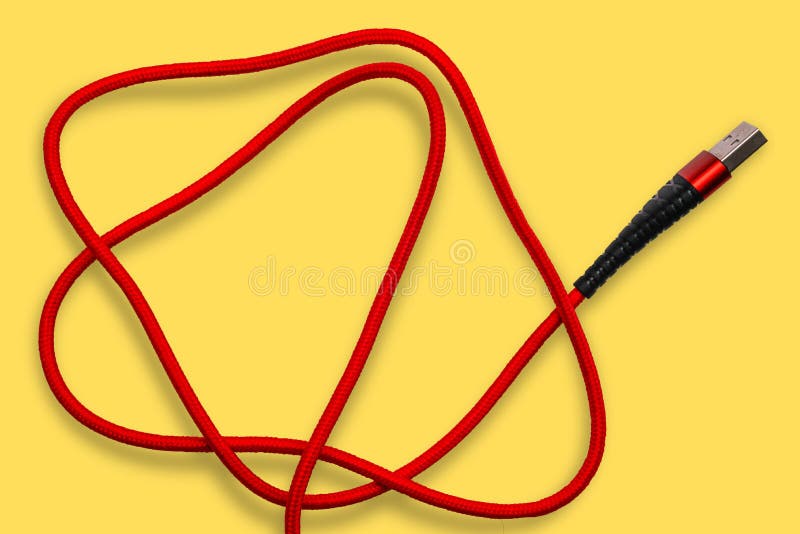 USB Cable on a Yellow Background. the Wire for the Phone, Charging Cord ...