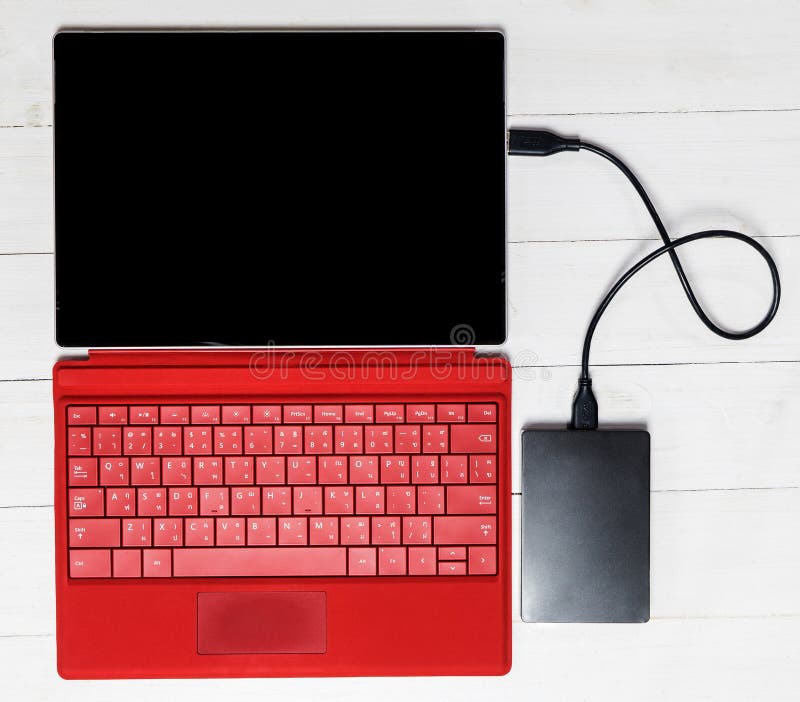 USB External Hard Disk on Red Tablet Computer Keyboard Stock Photo ...