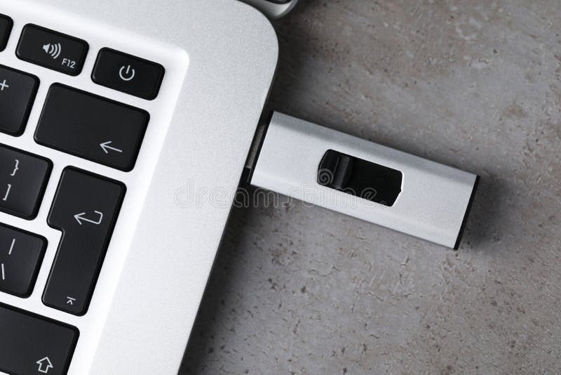 Usb Flash Drive Attached into Laptop on Light Grey Table, Top View ...