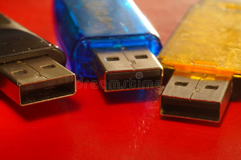 USB Flash Drive - Black, Yellow and Blue, on a Red Background. Stock ...