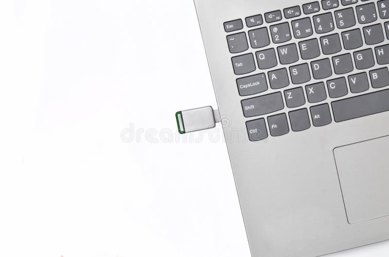 USB Flash Drive Inserted into a Laptop on a White Background. Modern ...