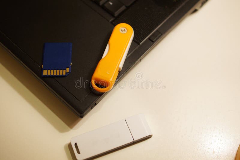 USB Flash Drive and Memory Card on Laptop Keyboard. Stock Photo - Image ...