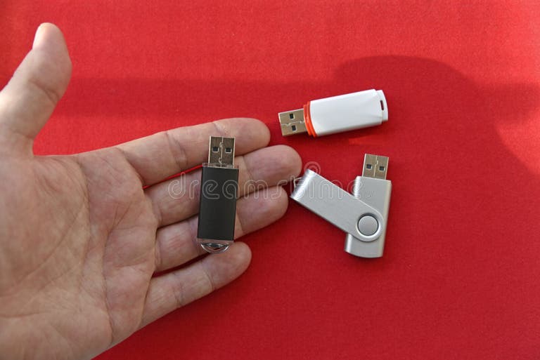 USB Flash Drive in the Palm of Your Hand on a Red Background Stock ...
