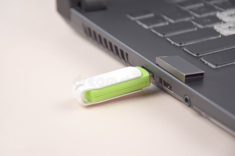 USB Memory Stick or Flash Drive on the Keyboard of an Open Laptop ...