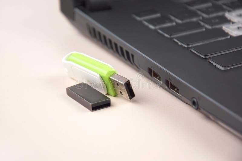 USB Memory Stick or Flash Drive on the Keyboard of an Open Laptop ...