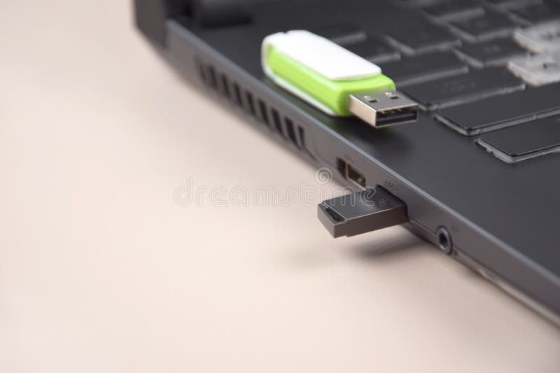USB Memory Stick or Flash Drive on the Keyboard of an Open Laptop ...