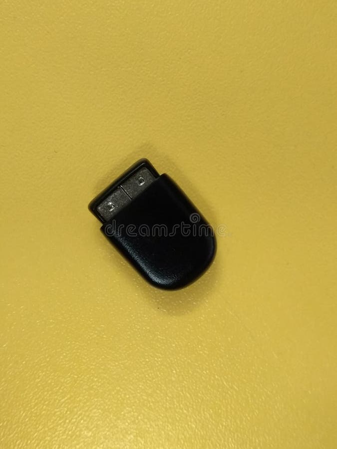 USB memory stick on yellow stock photo. Image of black - 132521722