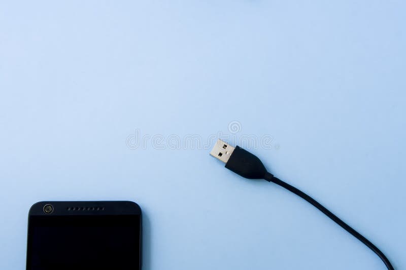 USB Plug with Mobile Phone on Light Pastel Blue Backgro Stock Image ...