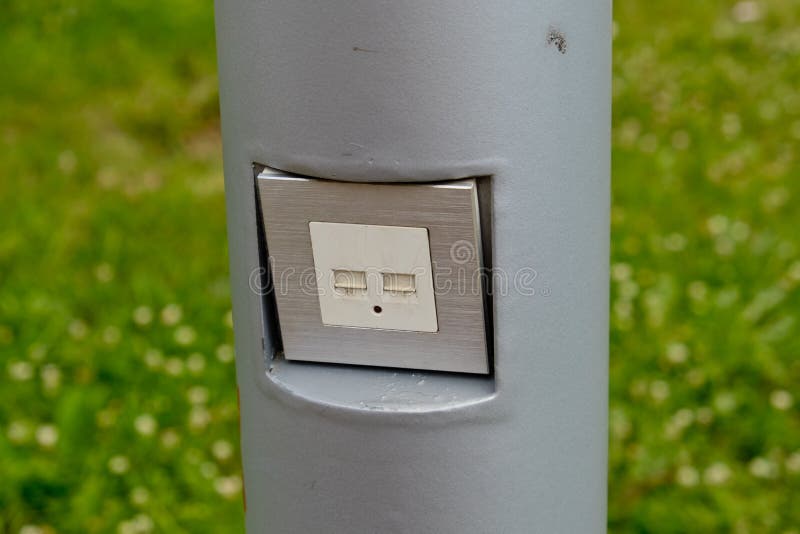 USB Socket for Charging Mobile Phones on a Pole in the Park. Stock ...