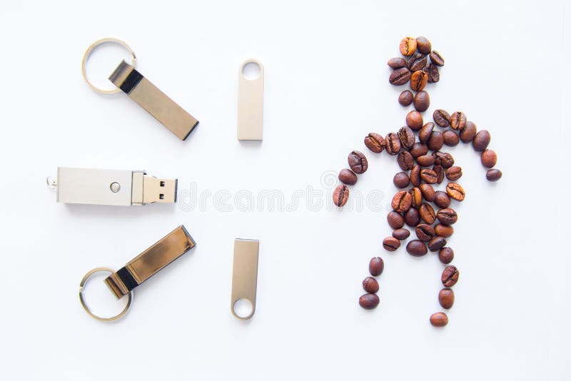 USB Stick and Coffee Beans in Human Form on a White Background Stock ...