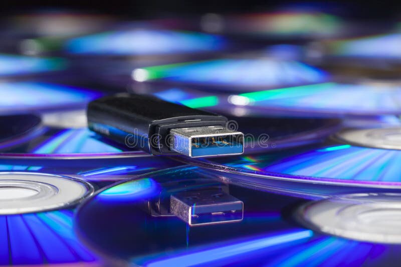 Usb stick on a pile of cds stock image. Image of disc - 104458187