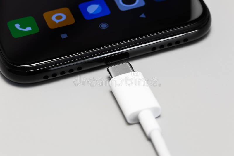 A White USB Type C / USB-C Cable Being Plugged into a Modern Notebook ...