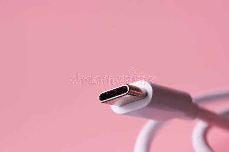 USB Type-C Connector with a White Wire on a Pink Background. Selective ...