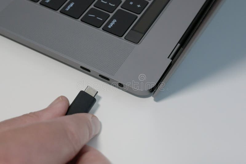 A USB Type C / USB-C Cable Being Plugged into a Modern Notebook ...