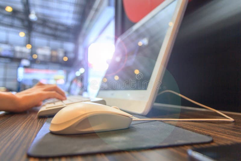 Use computer in net cafe stock photo. Image of woman - 92646576