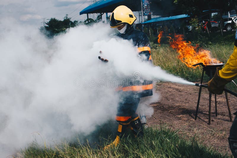 Use a Fire Extinguisher To Fire at the Firefighters Editorial Stock ...