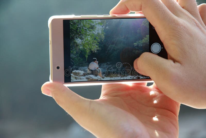 Use Mobile Phone To Capture the Situation To Effectively. Stock Image ...