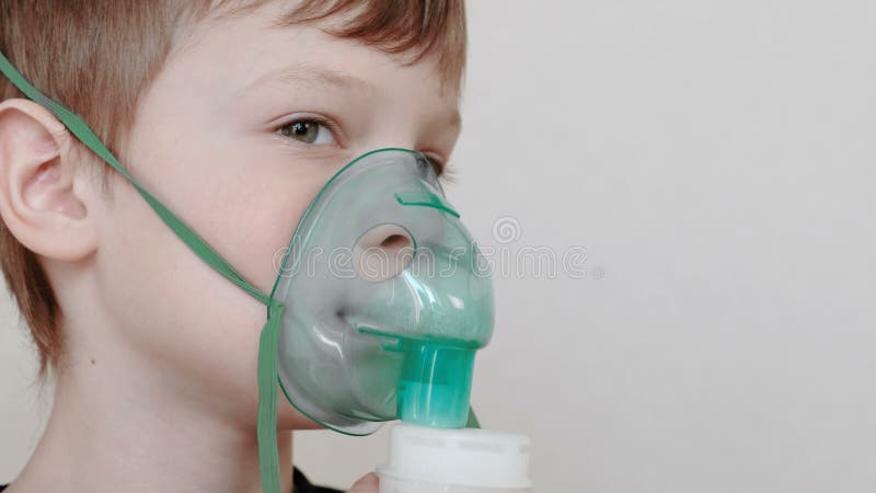 Use Nebulizer and Inhaler for the Treatment. Boy Inhaling through ...